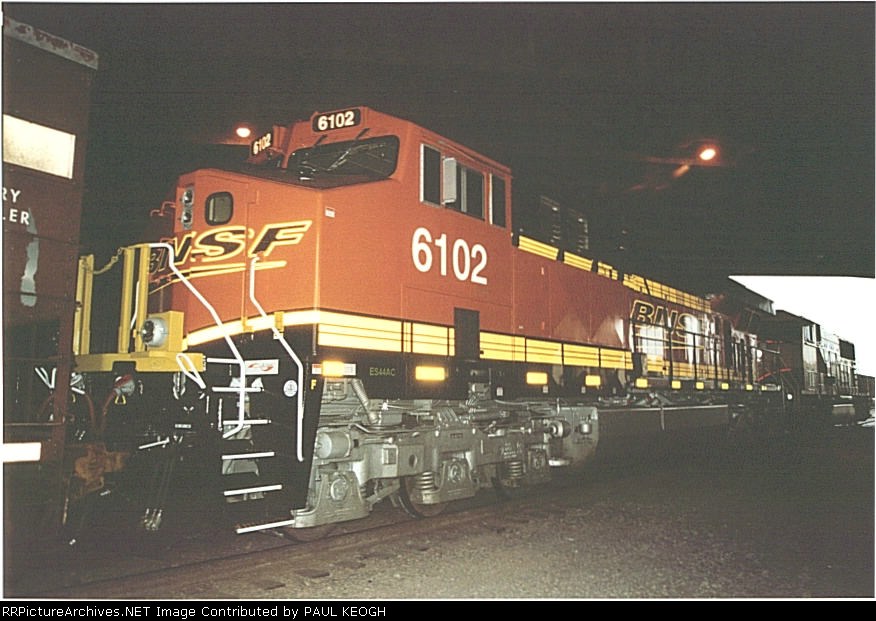 BNSF 6102 caught napping under the I-70 bridge Denver, Co as a rear DPU Built Sep 16, 2006 ...